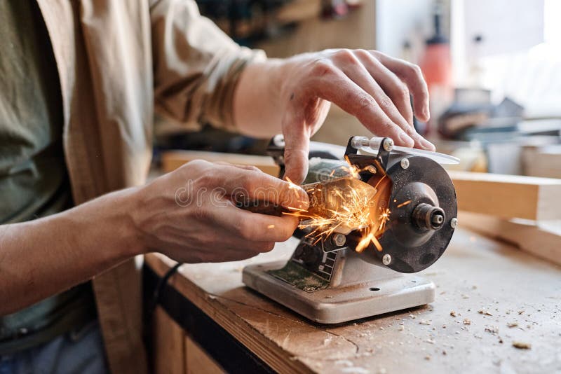 Woodworker Sharpening Knife in Workshop Stock Image - Image of ...