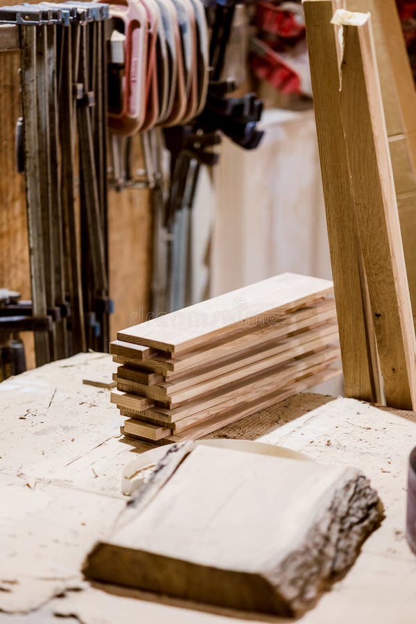 Woodworking Tools and Neatly Stacked Lumber in a Rustic Workshop during ...