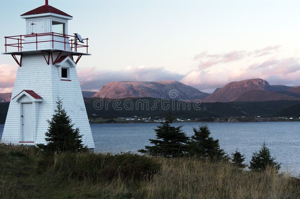 Woody Point Lighthouse, Sunset Stock Photo - Image of beach, landmark ...