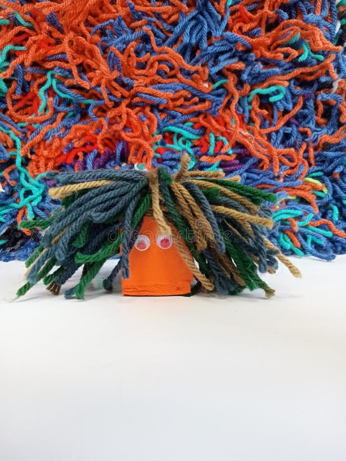 Wool Character with Googly Eyes and Yarn Hair on a White and Yarn ...