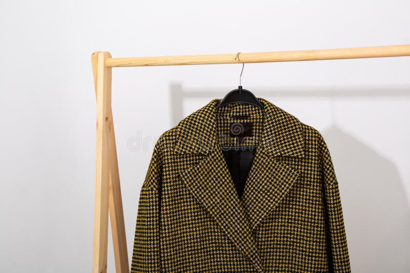 Wool Coat Hanging on a Hanger Stock Photo - Image of fashion, knit ...
