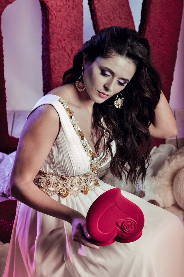 Striking,gorgeous Brunette Girl Look at Pink Cute Casket in Shape of ...