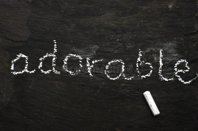 The Word Adorable Written with Chalk on Black Stone. Stock Photo ...
