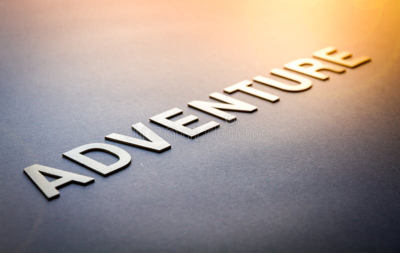 The Word ADVENTURE Written With Chalk On Black Stone. Stock Image ...