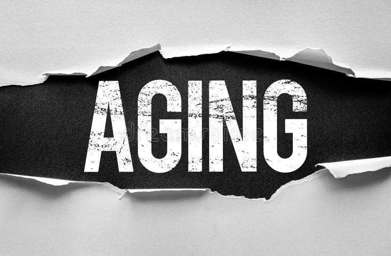 The Word AGING Appears through Torn Paper in a Bold, Distressed Font ...