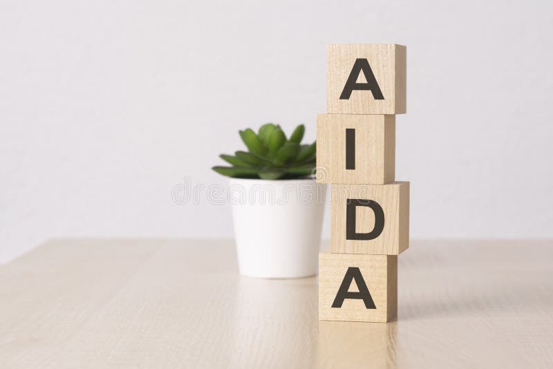 Word AIDA with Wood Building Blocks, Light Green Background. Front View ...
