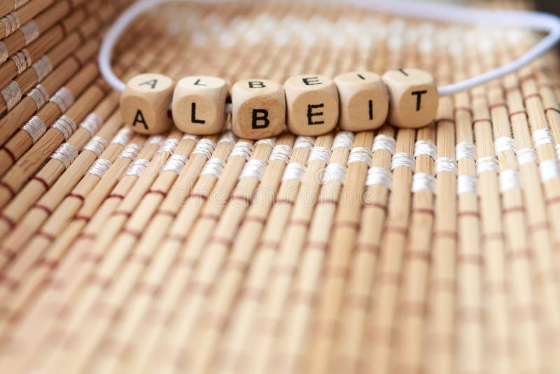 Word Albeit Lined with Wooden Cubes Stock Photo - Image of damsel ...