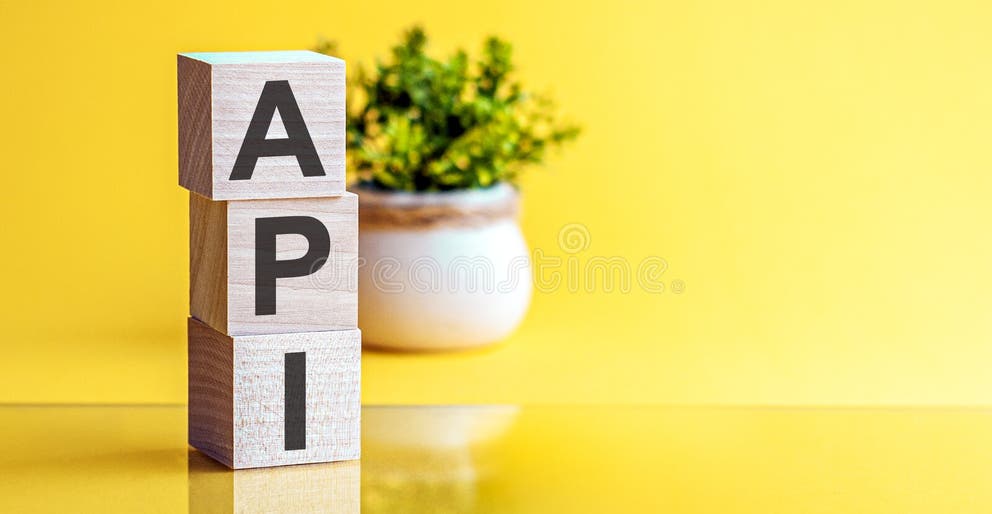 Word API is Made of Wooden Building Blocks on a Light Yellow Background ...