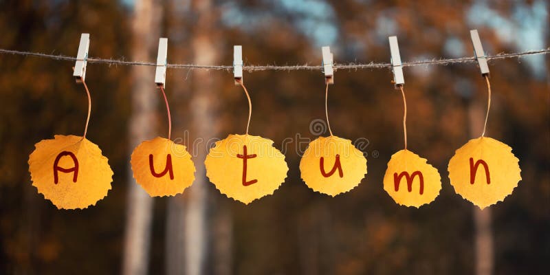 The Word Autumn is Written on the Autumn Leaves Hanging from the Rope ...