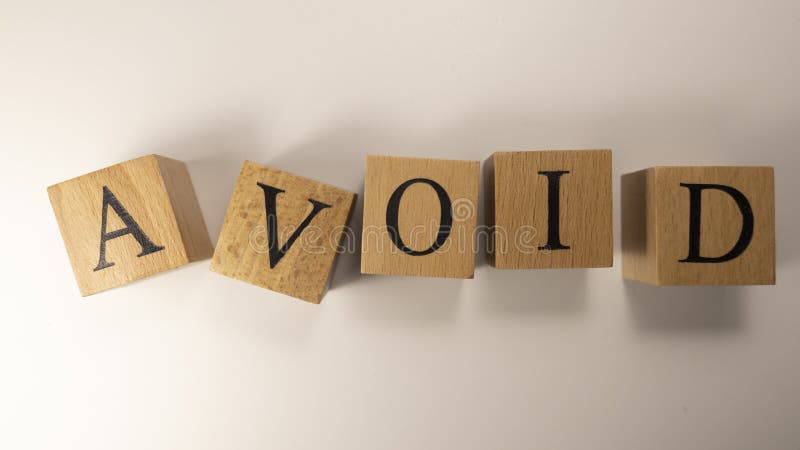 The Word AVOID Was Created from Wooden Cubes. Consumption and Shopping ...