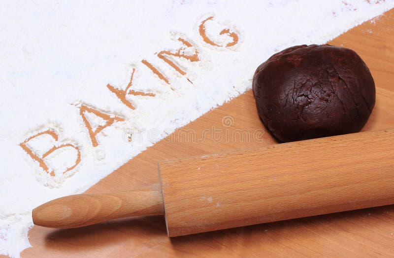 Word Baking Written in Flour and Dough for Gingerbread Stock Photo ...