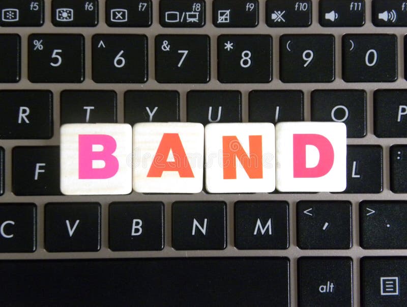 Word BAND on Wooden Cubes on a Blue Background. Business Concept Stock ...