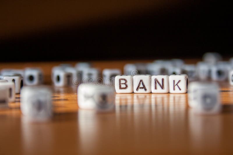 The Word BANK Made of White Plastic Blocks on the Table. Stock Image ...