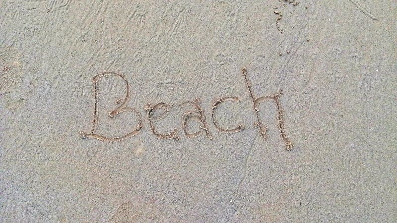The Word Beach Carved into the Beach Sand. Stock Photo - Image of ...