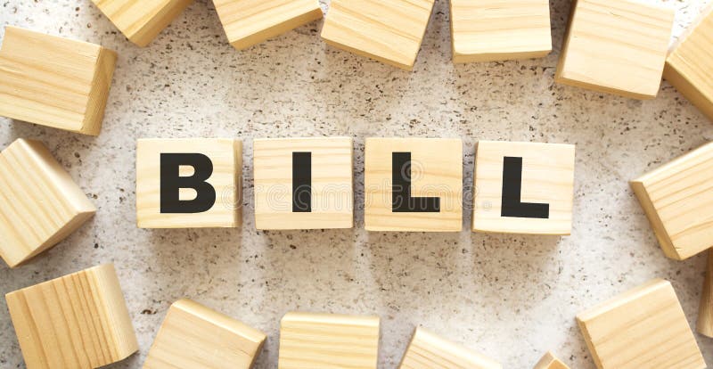 The Word BILL Consists of Wooden Cubes with Letters, Top View on a ...