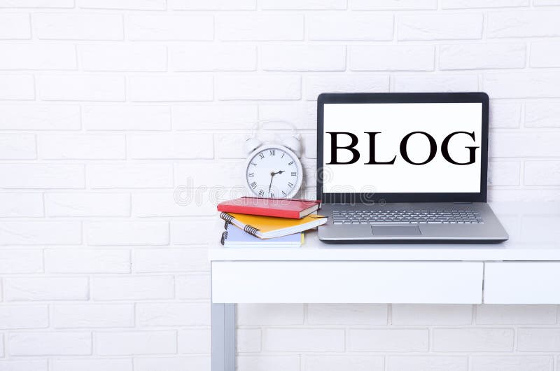 Word Blog on Computer Screen. Workspace with Laptop and Other Work ...