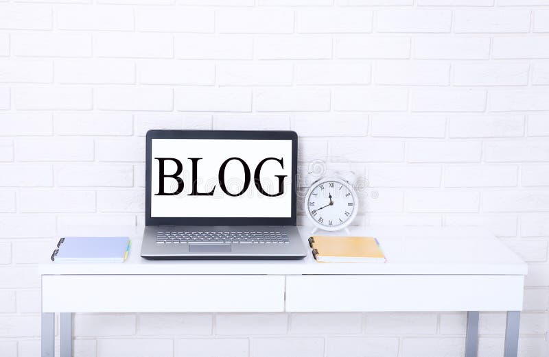 Word Blog on Computer Screen. Workspace with Laptop and Other Work ...