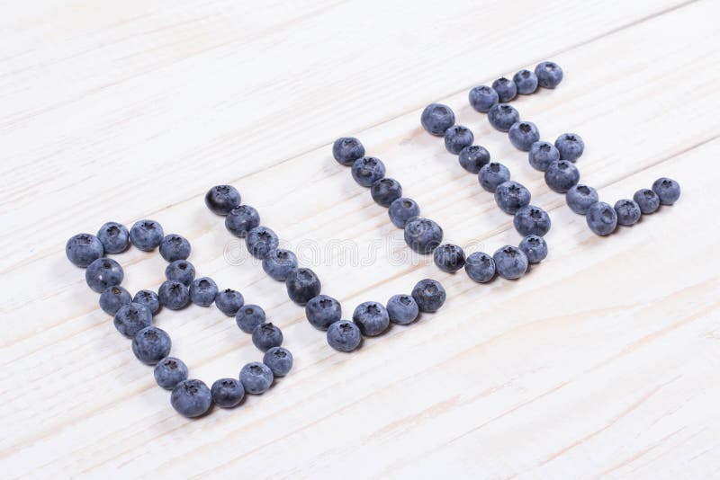 Word Blue Written Letters with Blueberries on White Wooden Board Stock ...
