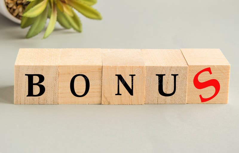 The Word BONUS, Reward for Work, is Written on the Wooden Cubes Stock ...