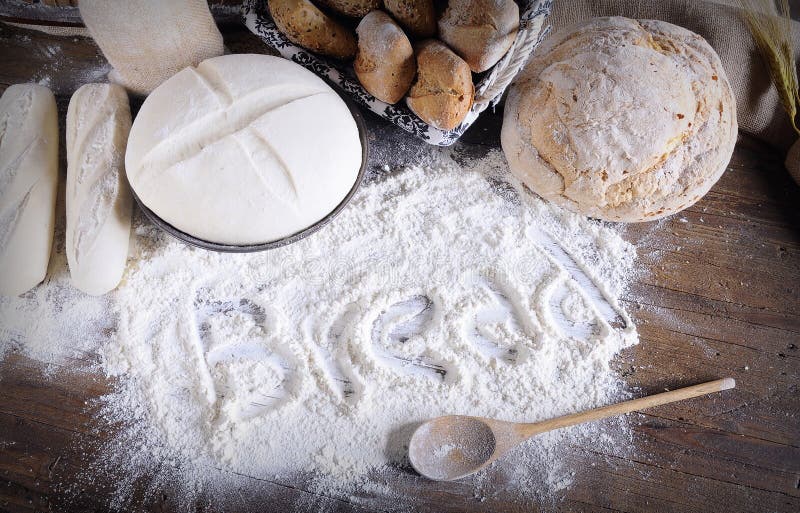 Word Bread Written on Flour Scattered on Wooden Table Stock Image ...