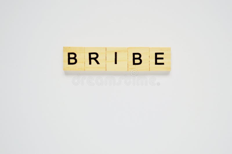 Word Bribe. Top View of Wooden Blocks with Letters on White Surface ...