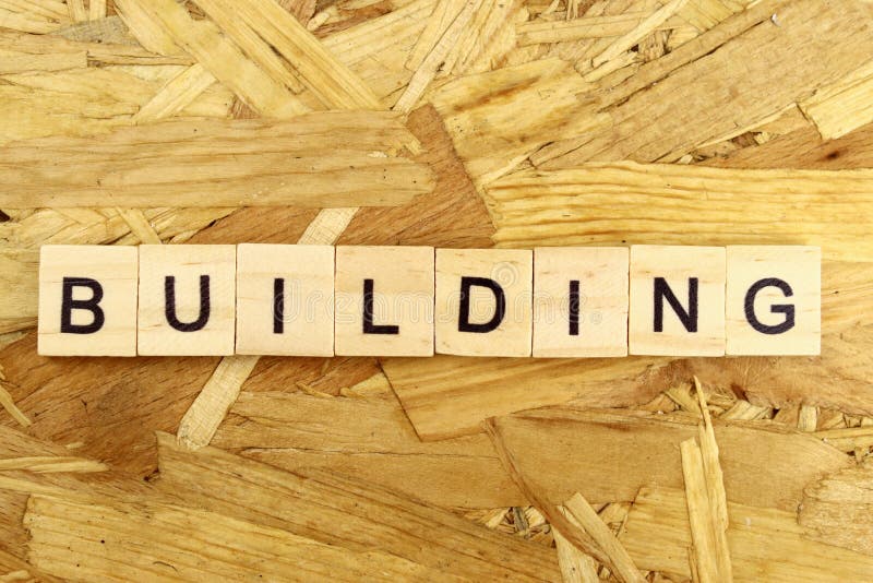 Word Building Made of Wooden Blocks on Osb Background Stock Photo ...