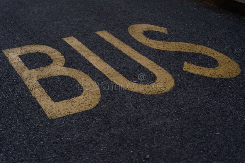 Word Bus on the Asphalt in the Bus Stop Stock Photo - Image of sign ...