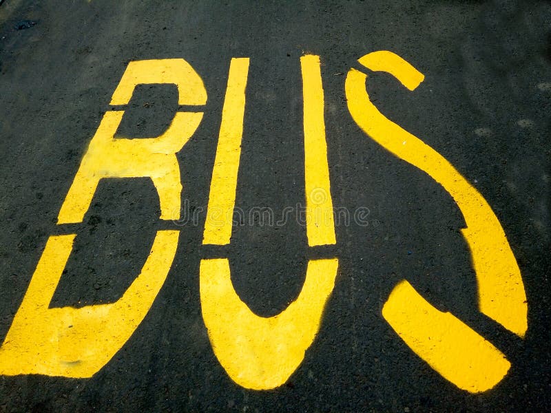 The Word Bus Painted in a Station on Asphalt Stock Photo - Image of ...