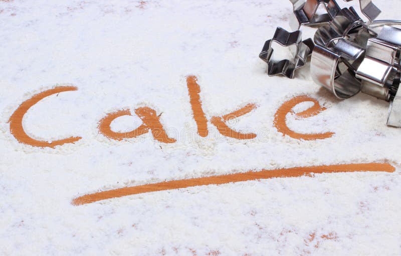 Word Cake Written in Flour and Cookie Cutters Stock Photo - Image of ...
