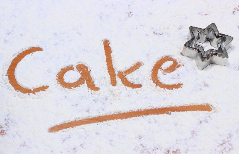 Word Cake Written in Flour and Cookie Cutters Stock Image - Image of ...