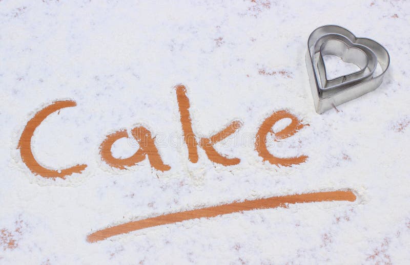 Word Cake Written in Flour and Cookie Cutters Stock Photo - Image of ...