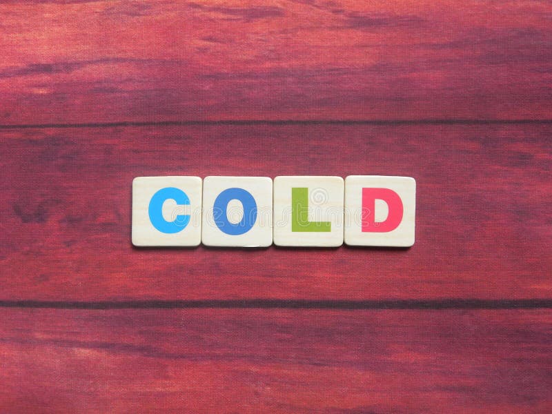 The Word COLD On A Blue Background Of Wooden Multicolored Letters, Ice ...
