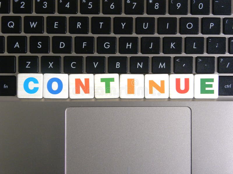 Word Continue on Keyboard Background Stock Photo - Image of process ...