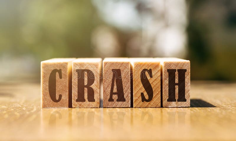 Word CRASH Made with Building Wooden Blocks on Table in Sunlight Stock ...