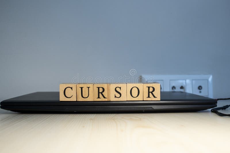 The Word Cursor is Written. Computer and Headset in the Background ...