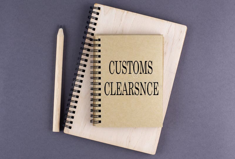 Word CUSTOMS CLEARANCE on Notebook with Pencil on the Grey Background ...