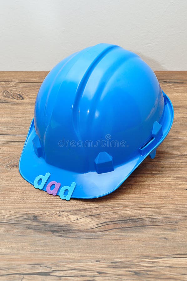 The Word Dad Displayed with a Blue Hardhat Stock Image - Image of color ...