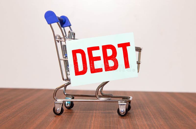 The Word DEBT is Written in Black Marker on the Yellow Paper for Notes ...