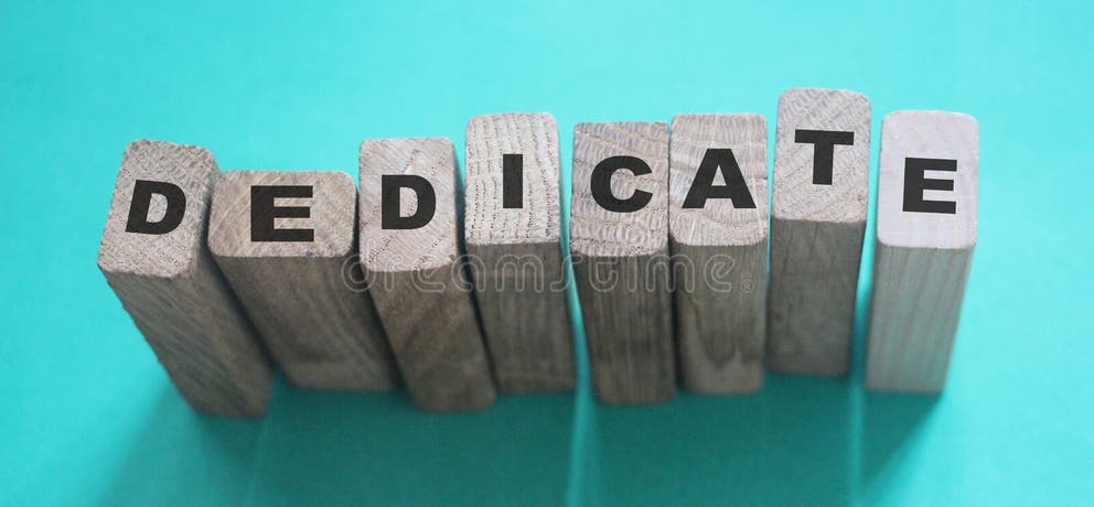 Word Dedicate on a Row of Wooden Blocks. Devotion Dedication Love ...