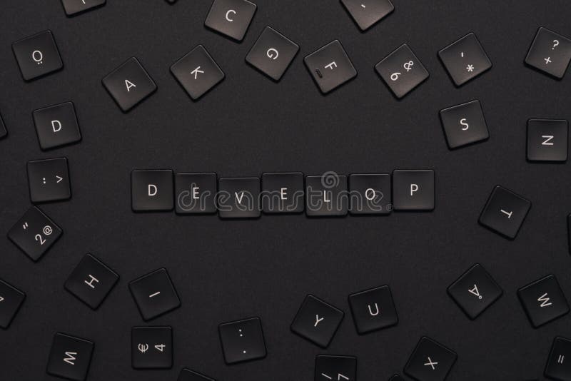 The Word `Develop` Assembled from Black Keyboard Keys Stock Photo ...