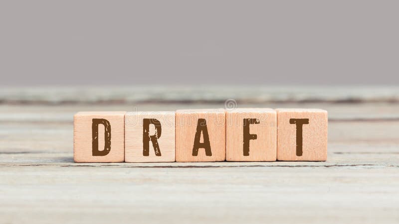 Word draft on wood cubes stock image. Image of type - 241561493