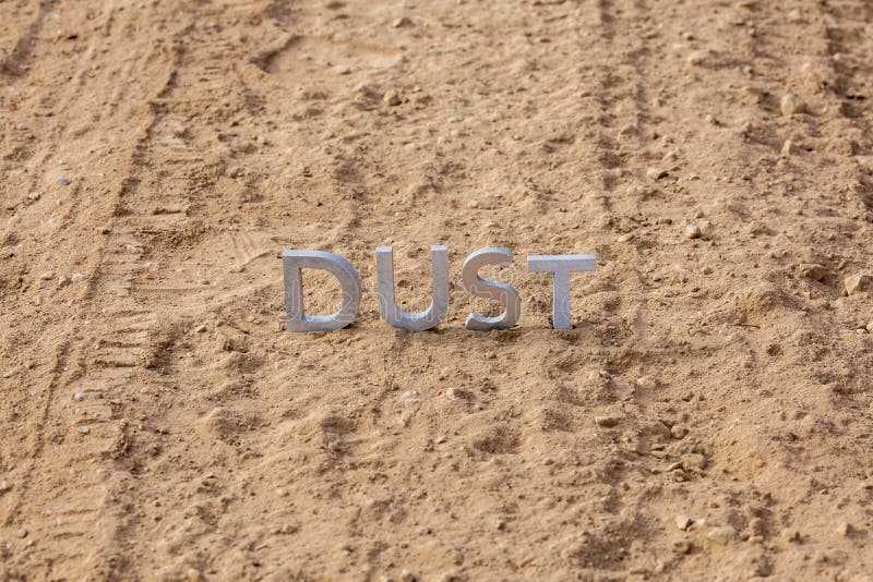 The Word Dust Embossed On Dusty Road Surface In Flat Lay Perspective ...