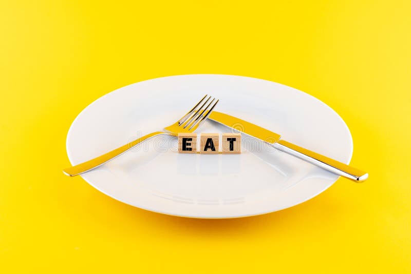 Word Eat on Wooden Blocks on a Plate Stock Image - Image of measure ...