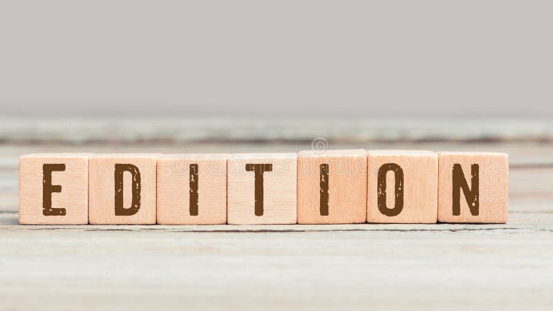 Word Edition on wood cubes stock image. Image of information - 241695635