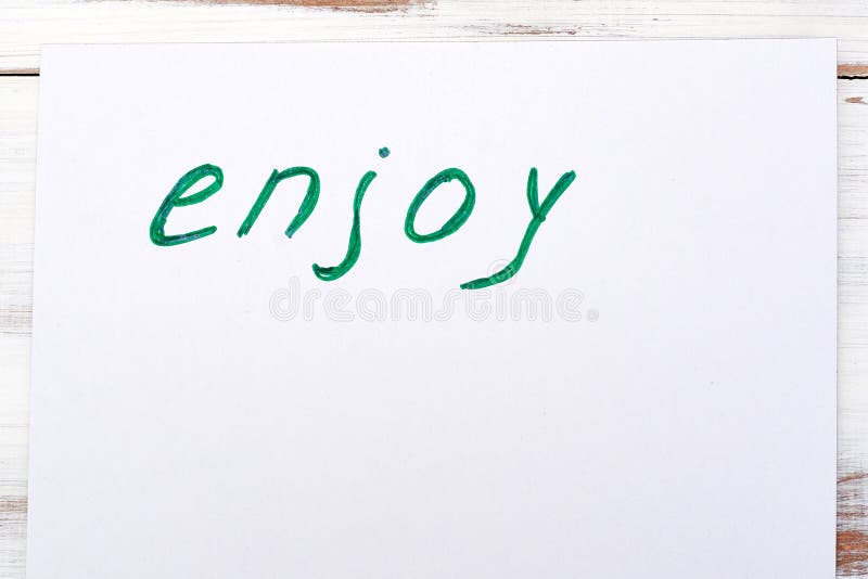 Word Enjoy Handwritten On Sandy Beach With Soft Ocean Wave On ...