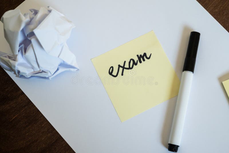 Word Exam Written with Black Pen on Paper Stock Photo - Image of work ...
