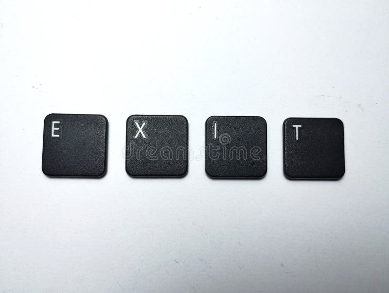 EXIT Written on a Wooden Cube on the Keyboard with Chart on Grey ...