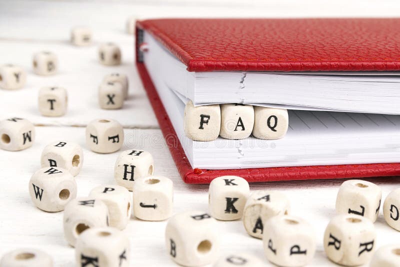 Word FAQ Written in Wooden Blocks in Notebook on White Wooden Ta Stock ... Word FAQ Written in Wooden Blocks in Notebook on White Wooden Ta Stock ...