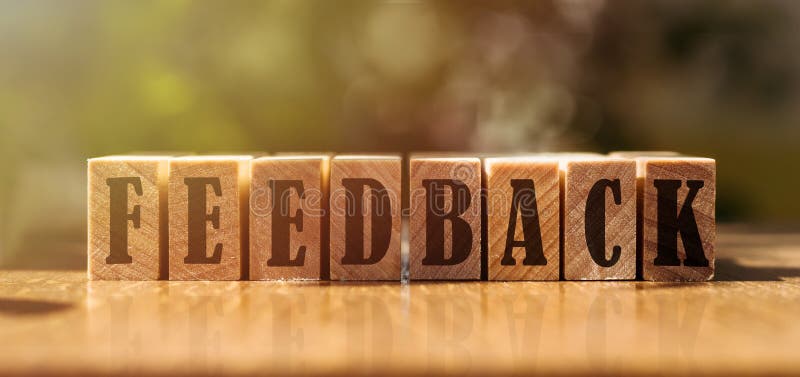 Word Feedback Made with Building Wooden Blocks on Table in Sunlight ...