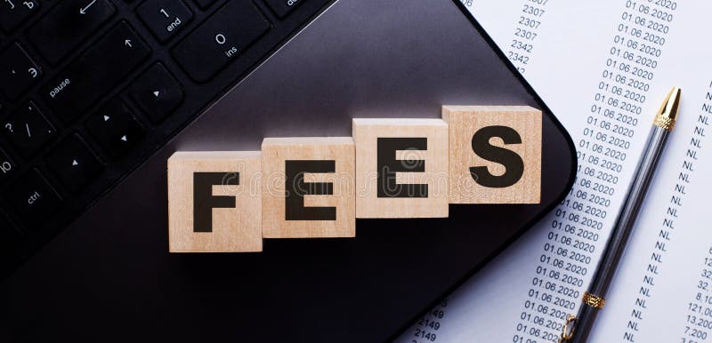 The Word FEES on Stacks of Gold Coins on a White Background Stock Image ...